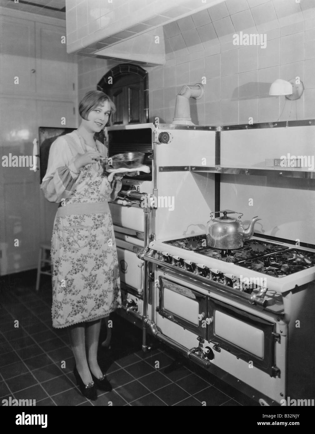 Female Cook Stove Black and White Stock Photos & Images - Alamy