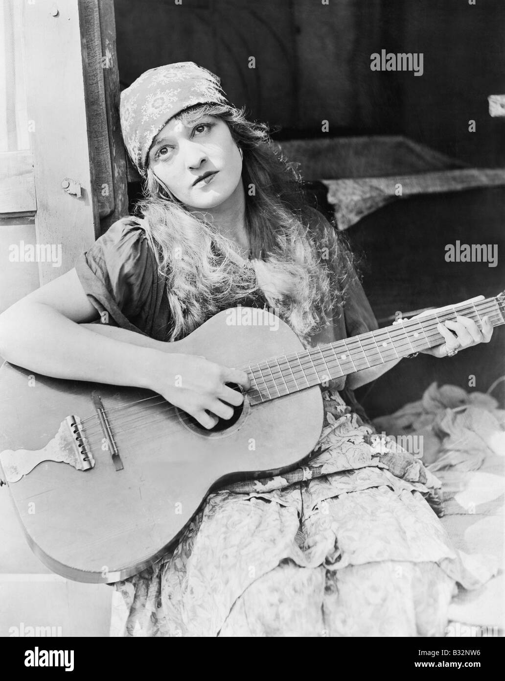 Female guitarist playing guitar Black and White Stock Photos & Images ...