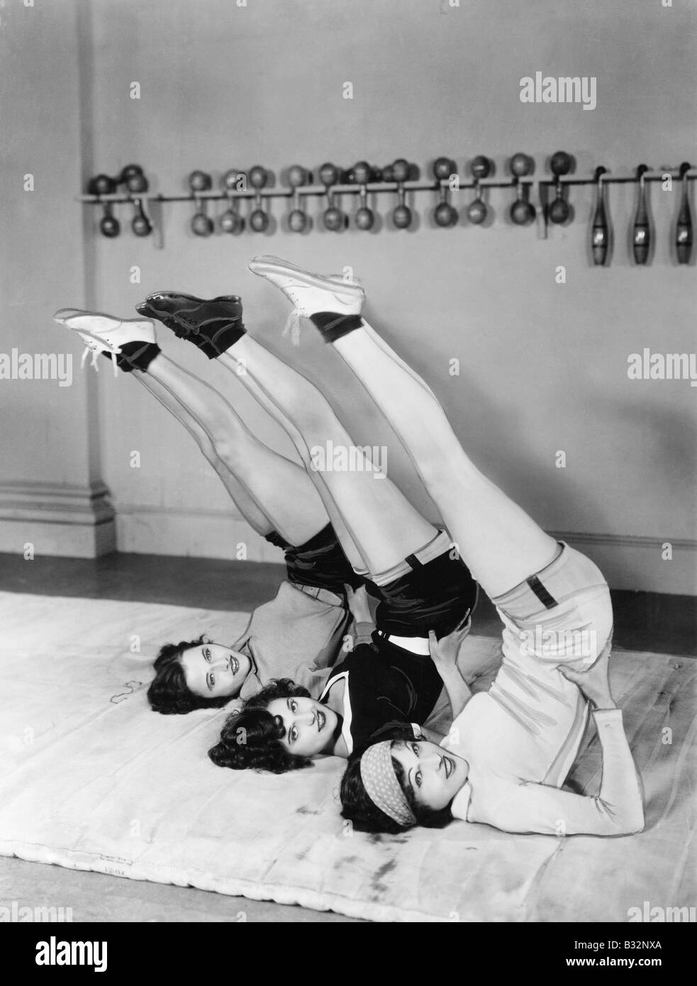 Three women exercising Stock Photo - Alamy