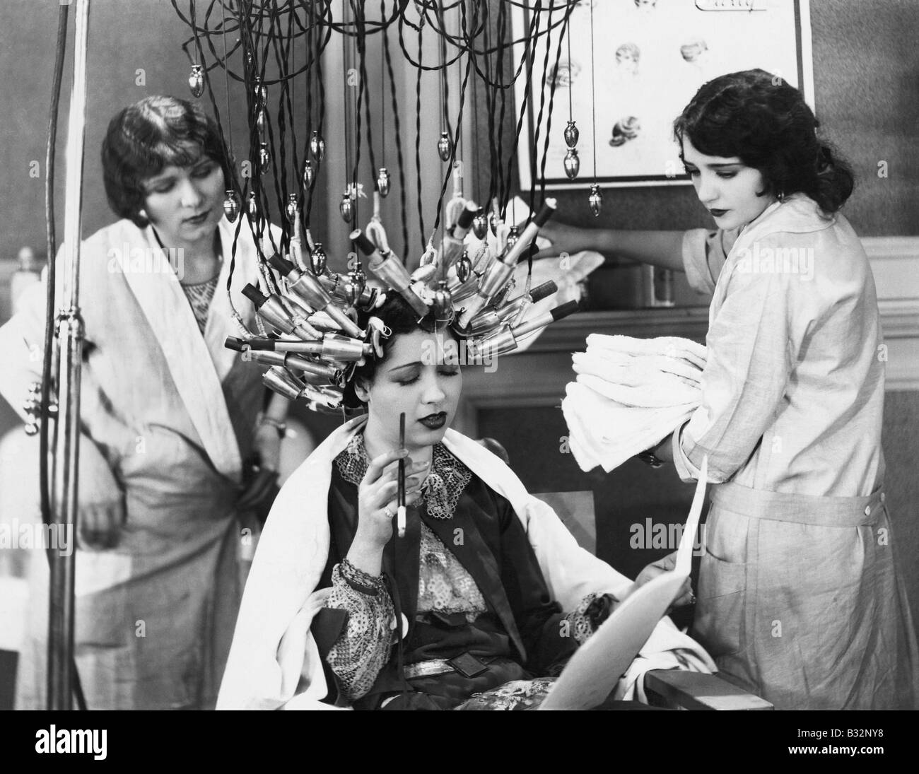 Woman having hair done hi-res stock photography and images - Alamy