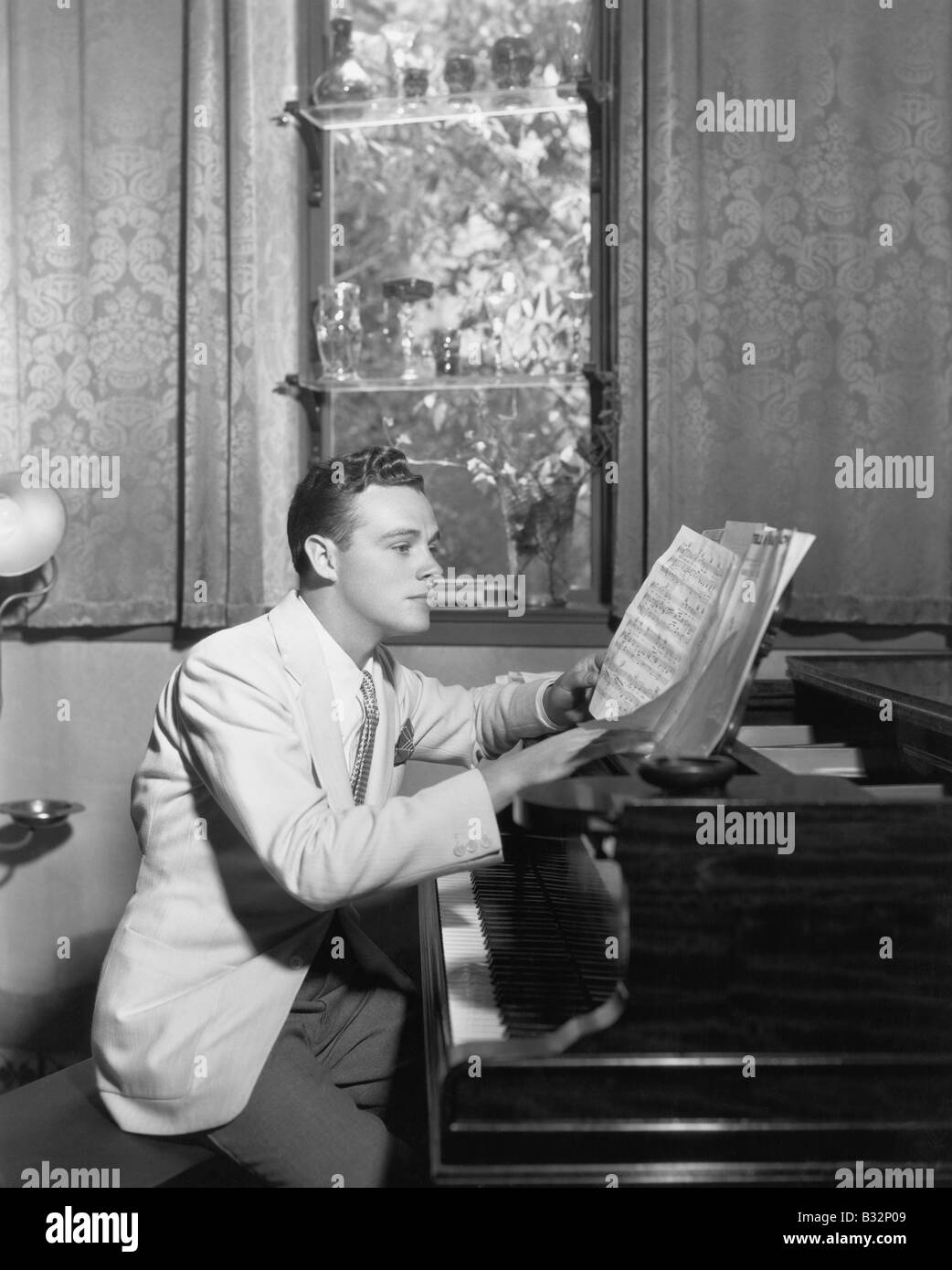 Man musician pianist playing piano Black and White Stock Photos ...