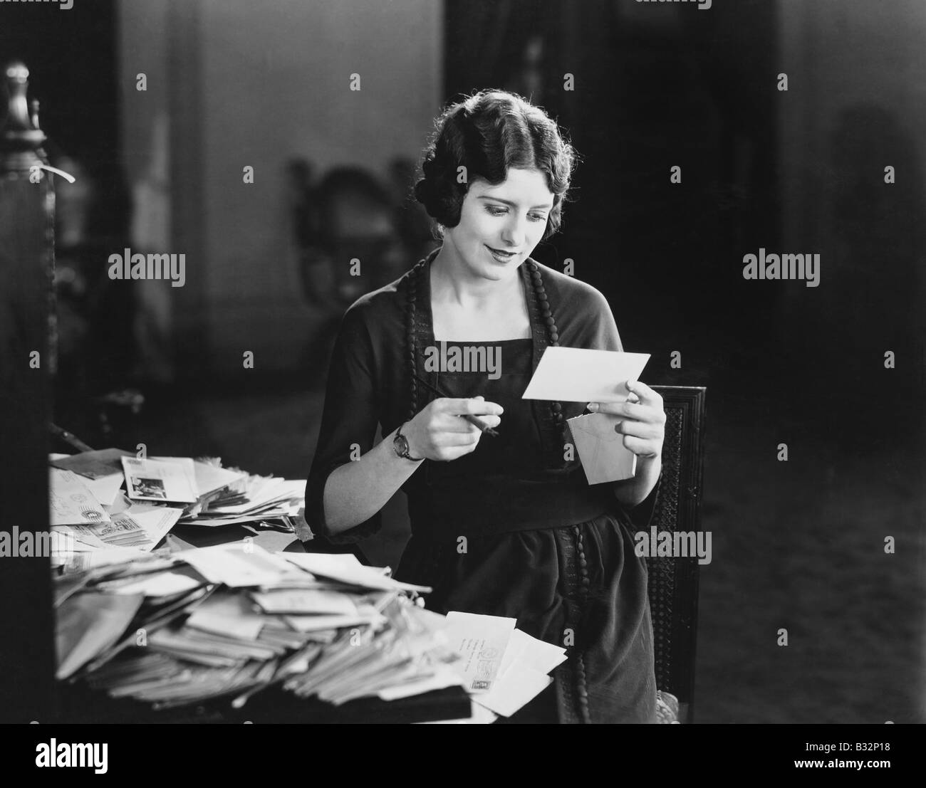 Smiling woman reading Black and White Stock Photos & Images - Alamy