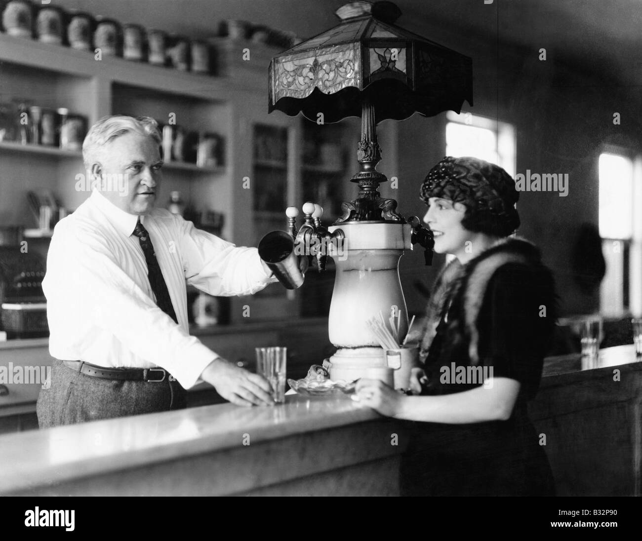 Woman drinking alcohol bar Black and White Stock Photos & Images - Alamy