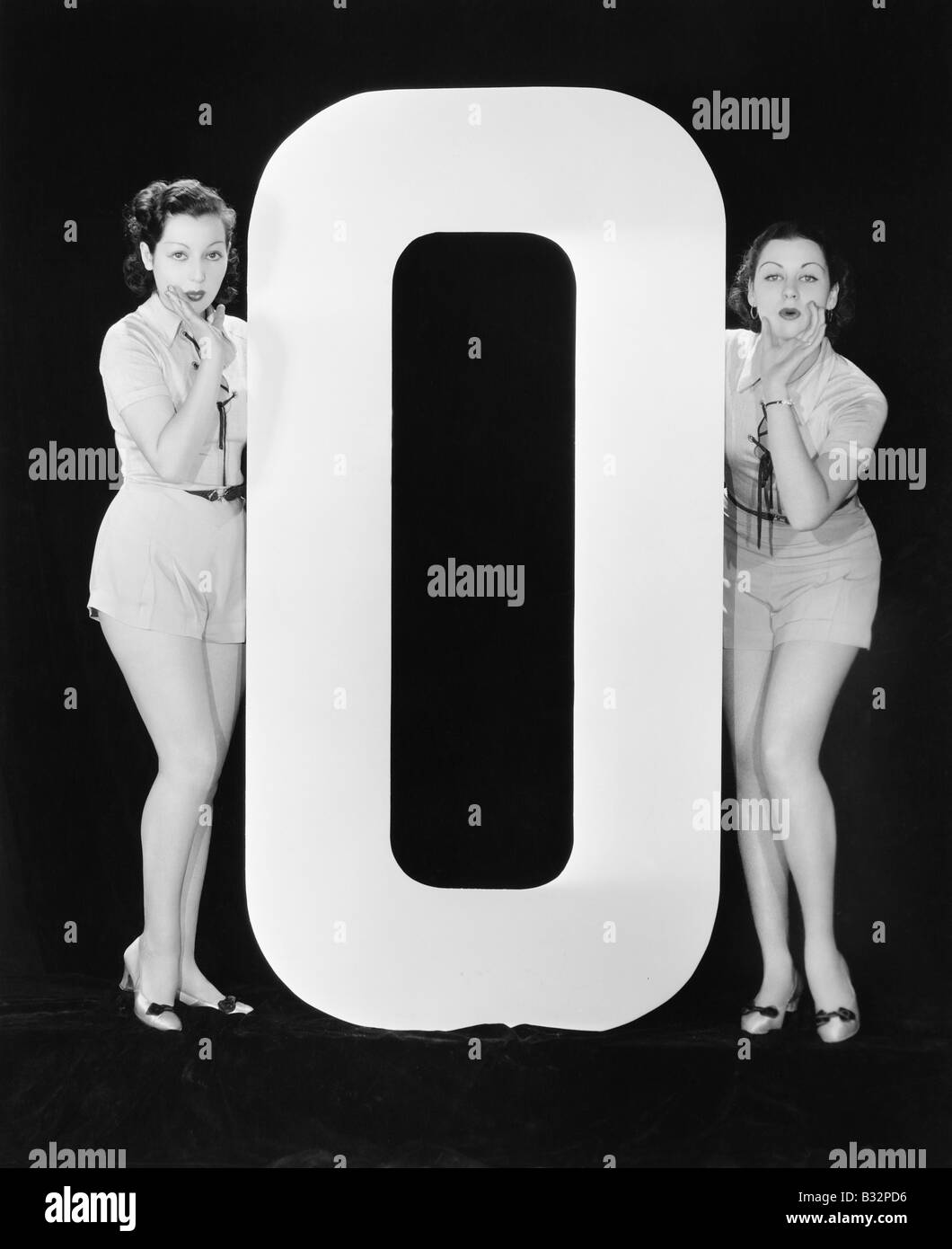 Women with huge letter O Stock Photo - Alamy