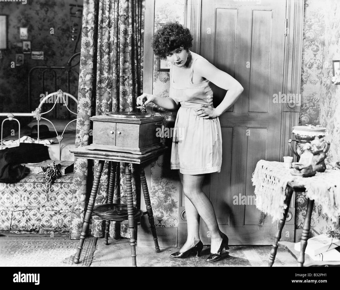 Woman playing record player Stock Photo - Alamy