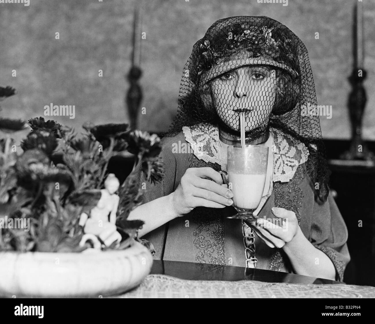 Retro woman drinking Black and White Stock Photos & Images - Alamy
