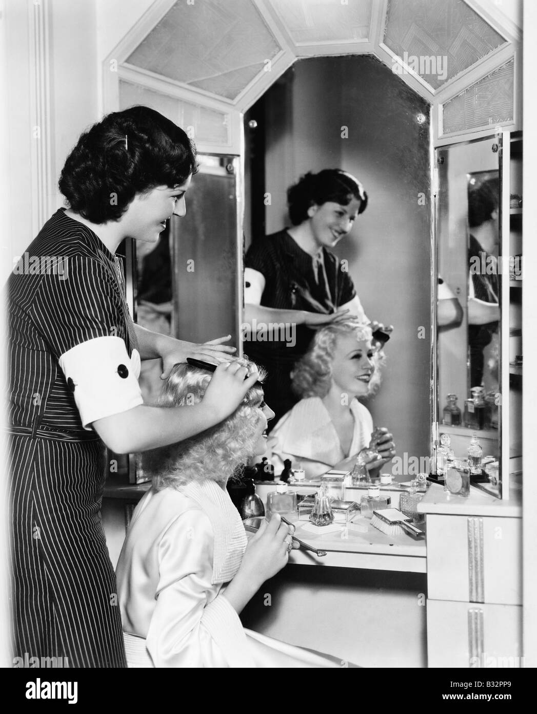 Combing hair styling in Black and White Stock Photos & Images - Alamy