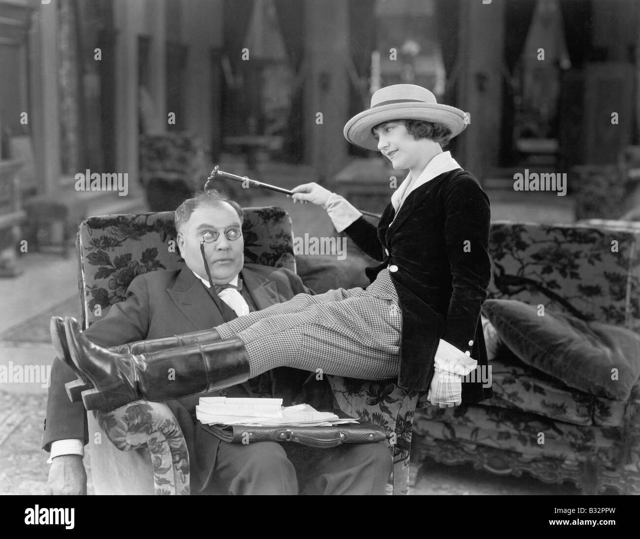 Adult daughter tapping dad on head Stock Photo - Alamy