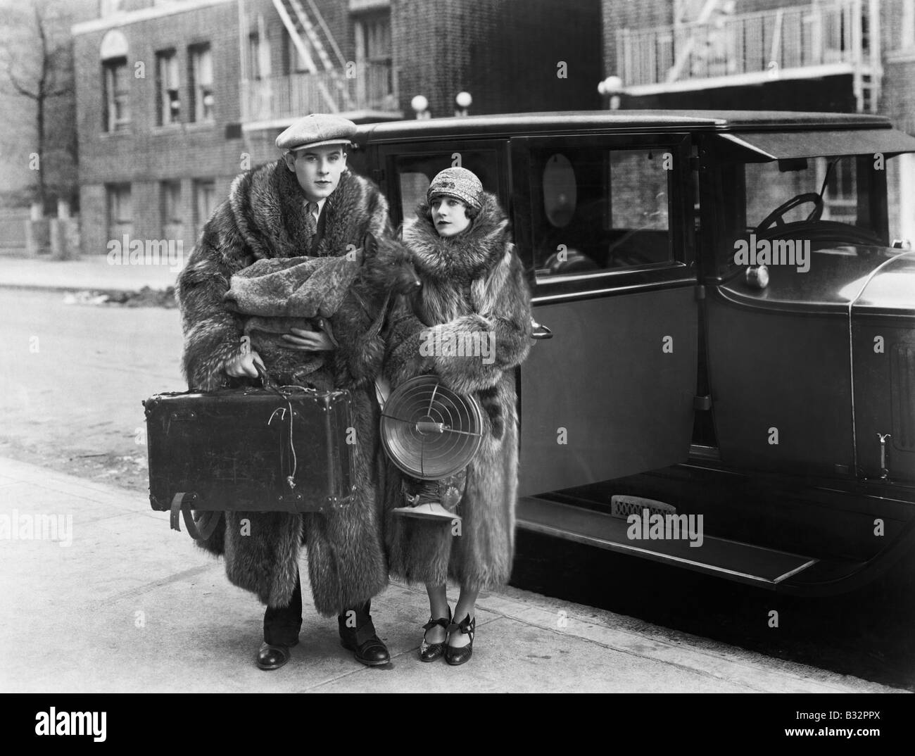 Woman car fur furs Black and White Stock Photos & Images - Alamy