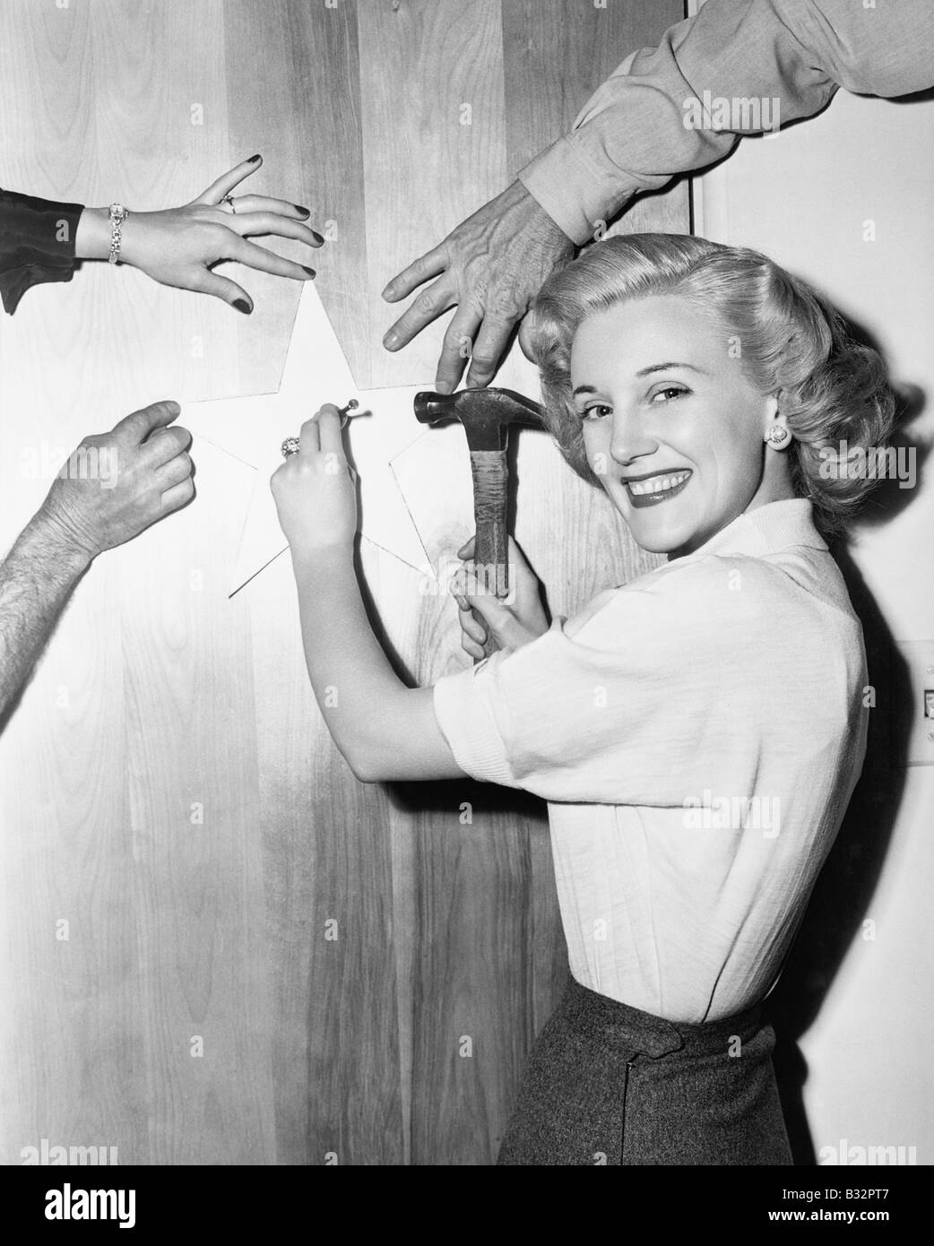 Smiling woman working hand Black and White Stock Photos & Images - Alamy