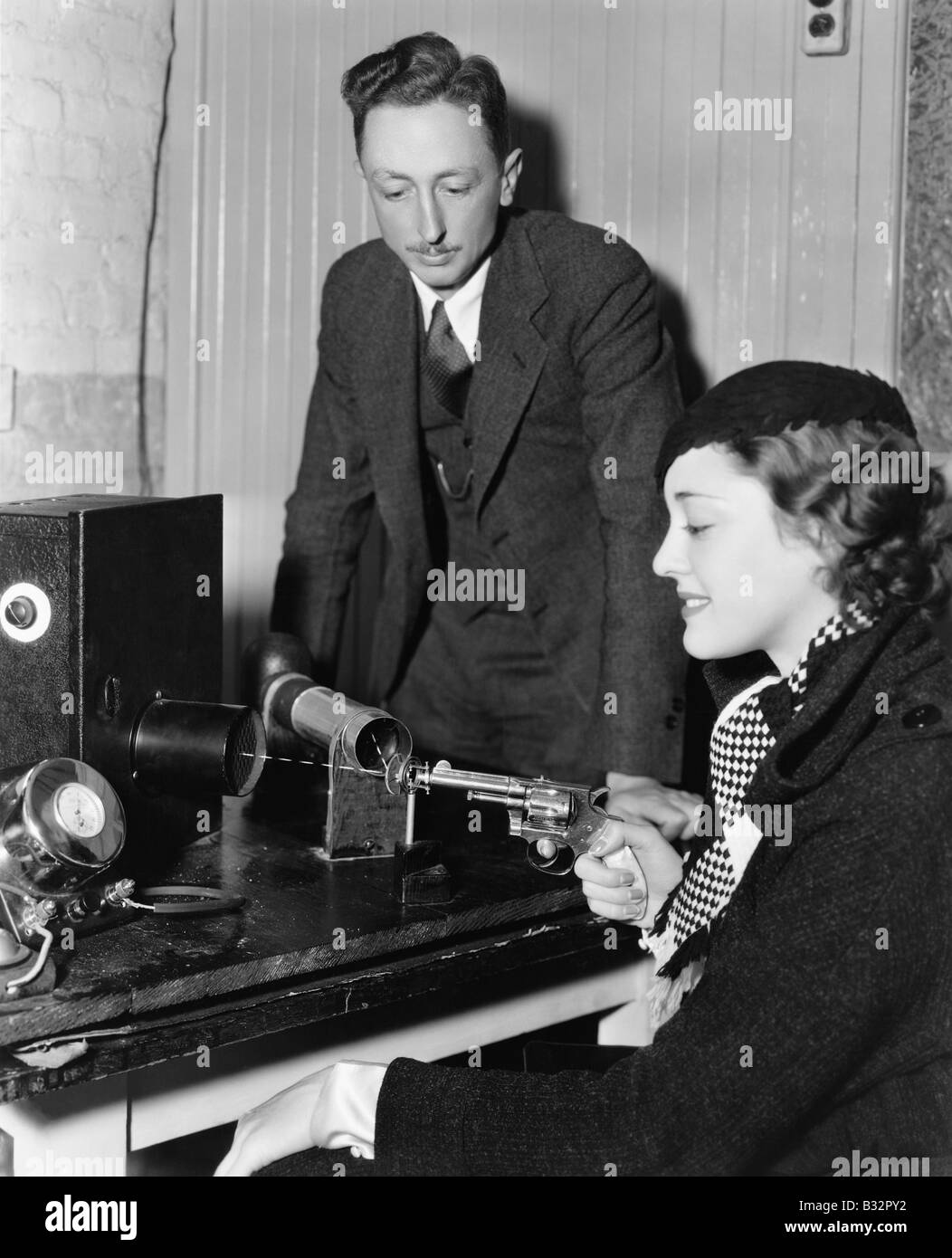 Young man aiming gun Black and White Stock Photos & Images - Alamy