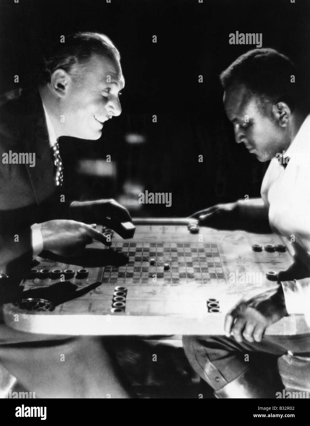 Two men playing backgammon Stock Photo - Alamy