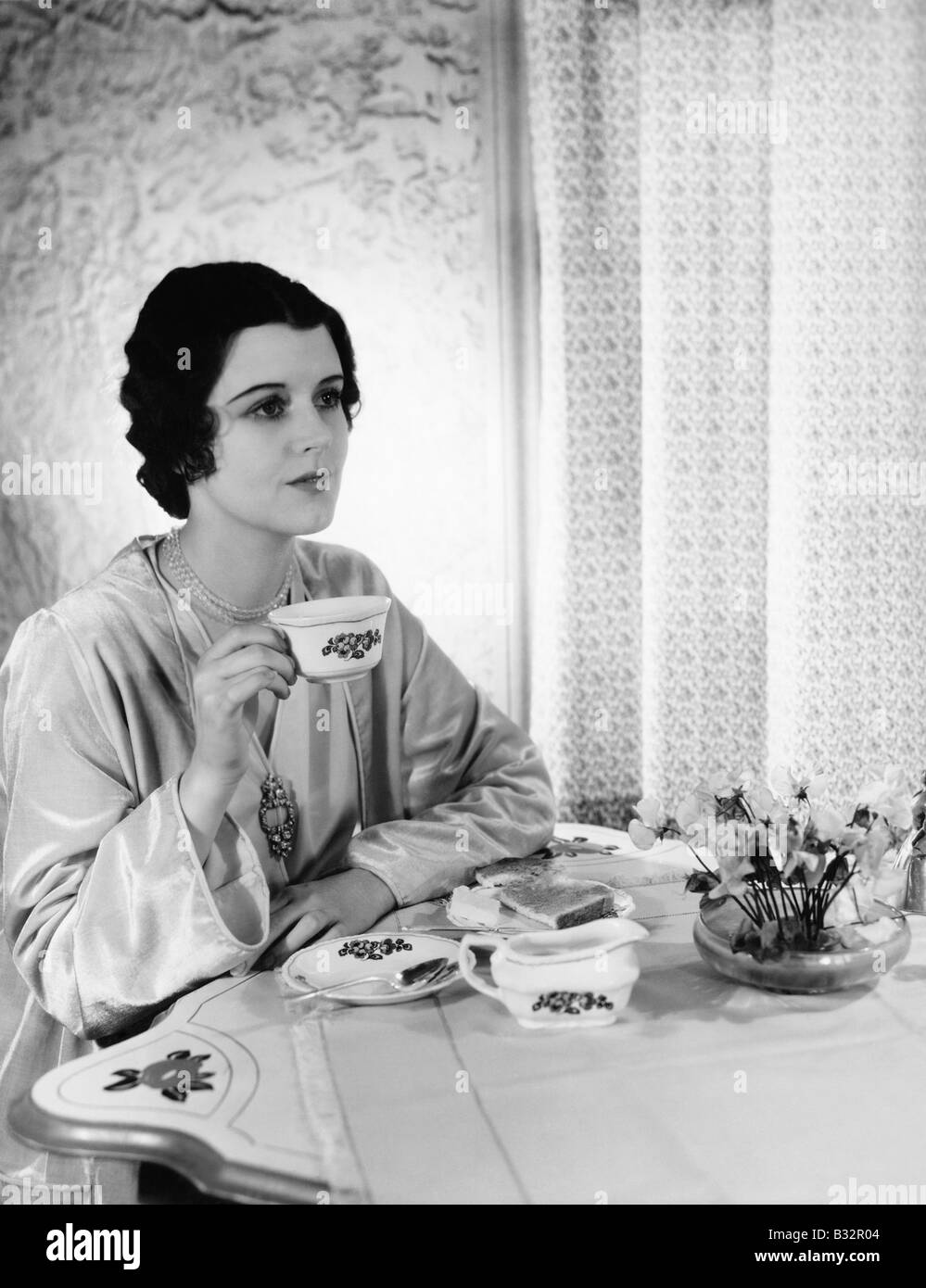 Pretty woman drinking coffee Black and White Stock Photos & Images - Alamy