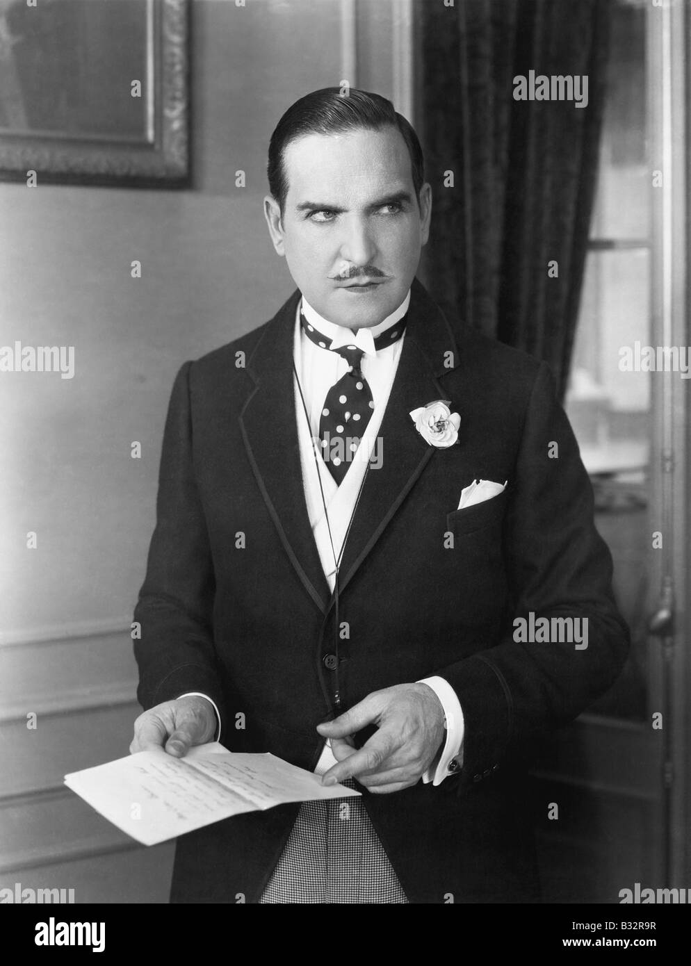 Man holding paper in Black and White Stock Photos & Images - Alamy