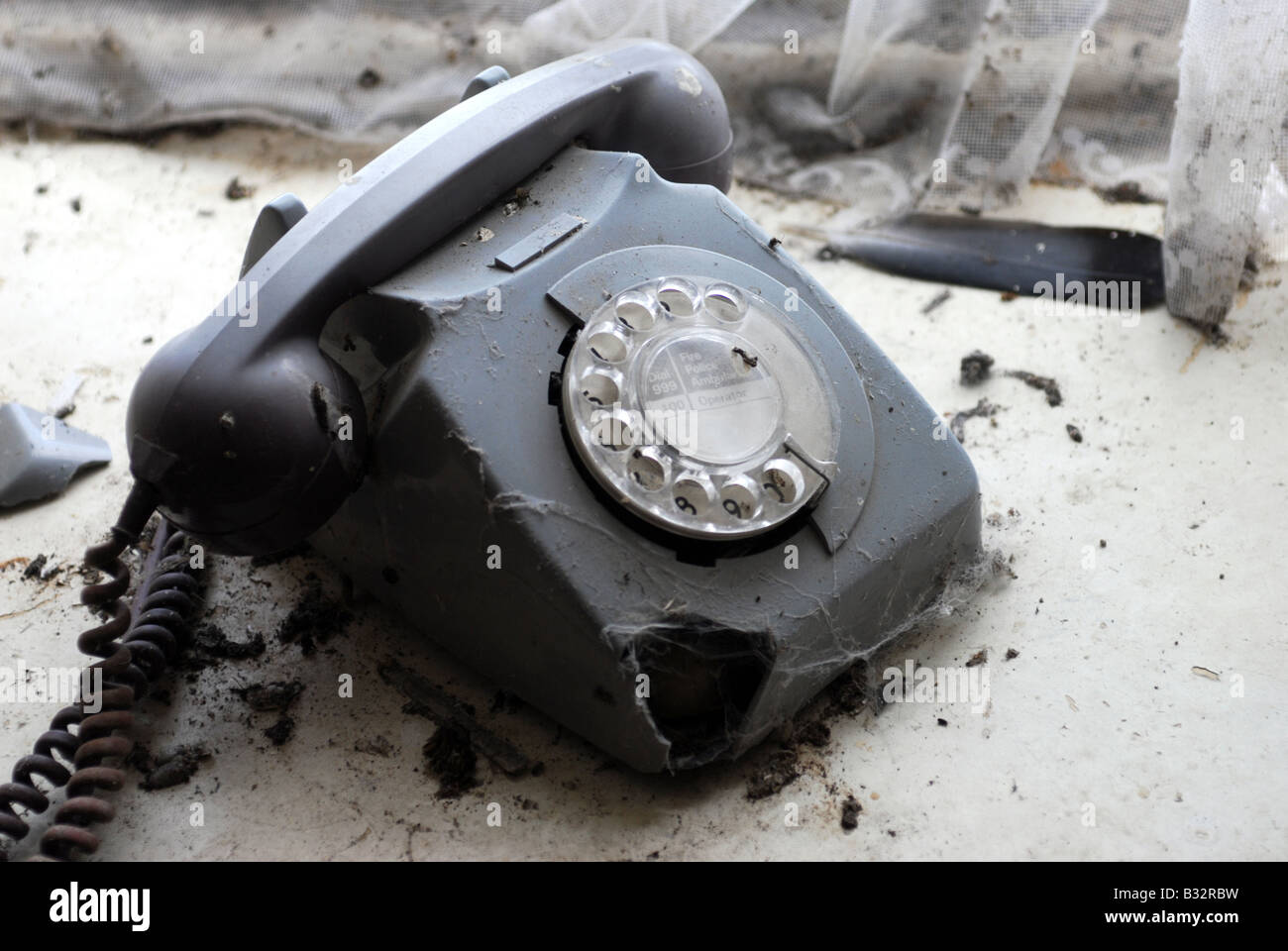 an old telephone covered in cobwebs in an abandoned farmstead in North ...