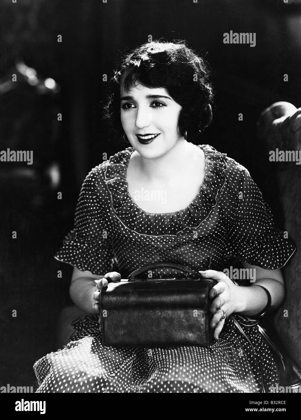 Smiling woman sitting Black and White Stock Photos & Images - Alamy