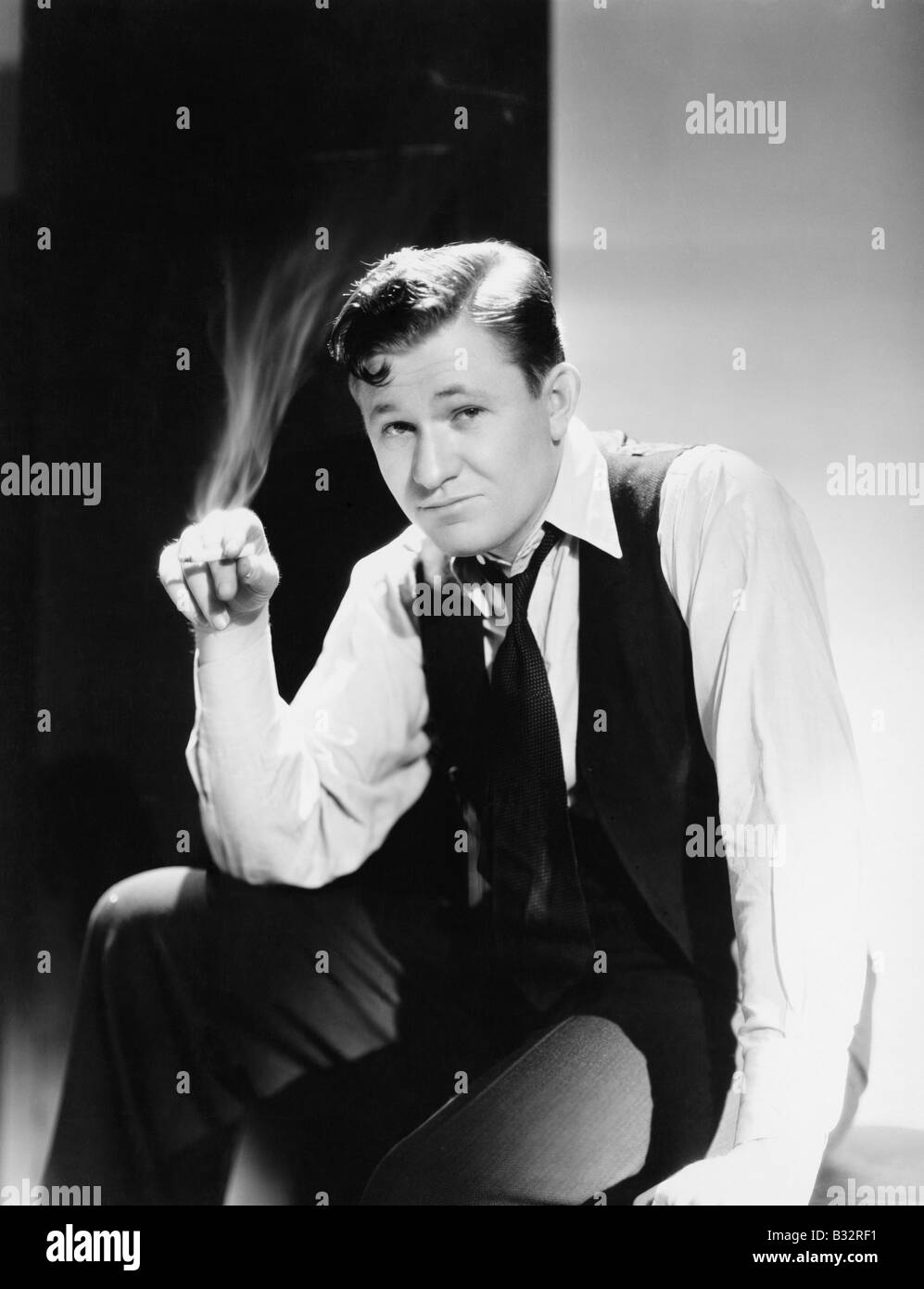 Man sitting and smoking a cigarette Stock Photo - Alamy