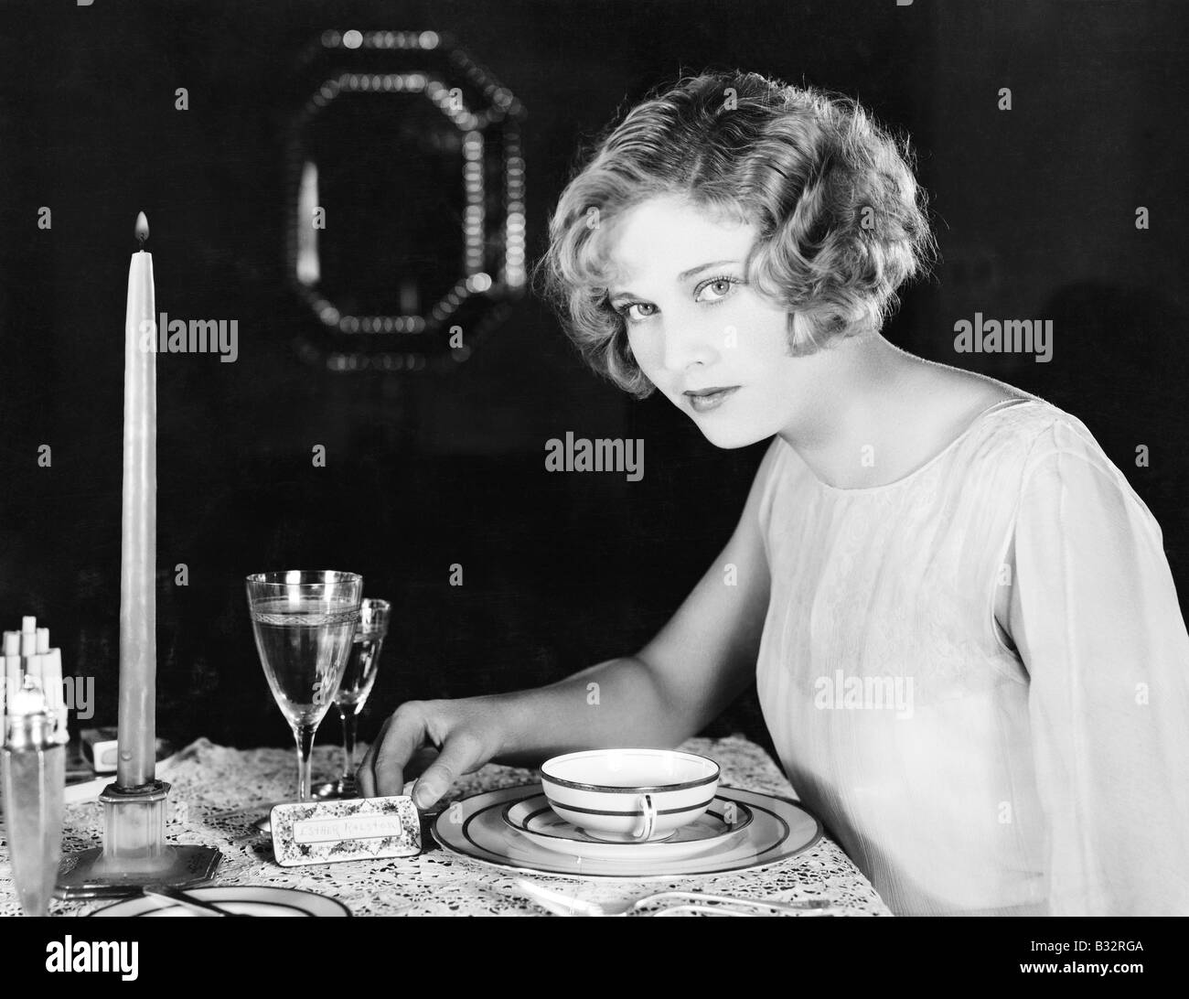 Mid adult female sitting Black and White Stock Photos & Images - Alamy