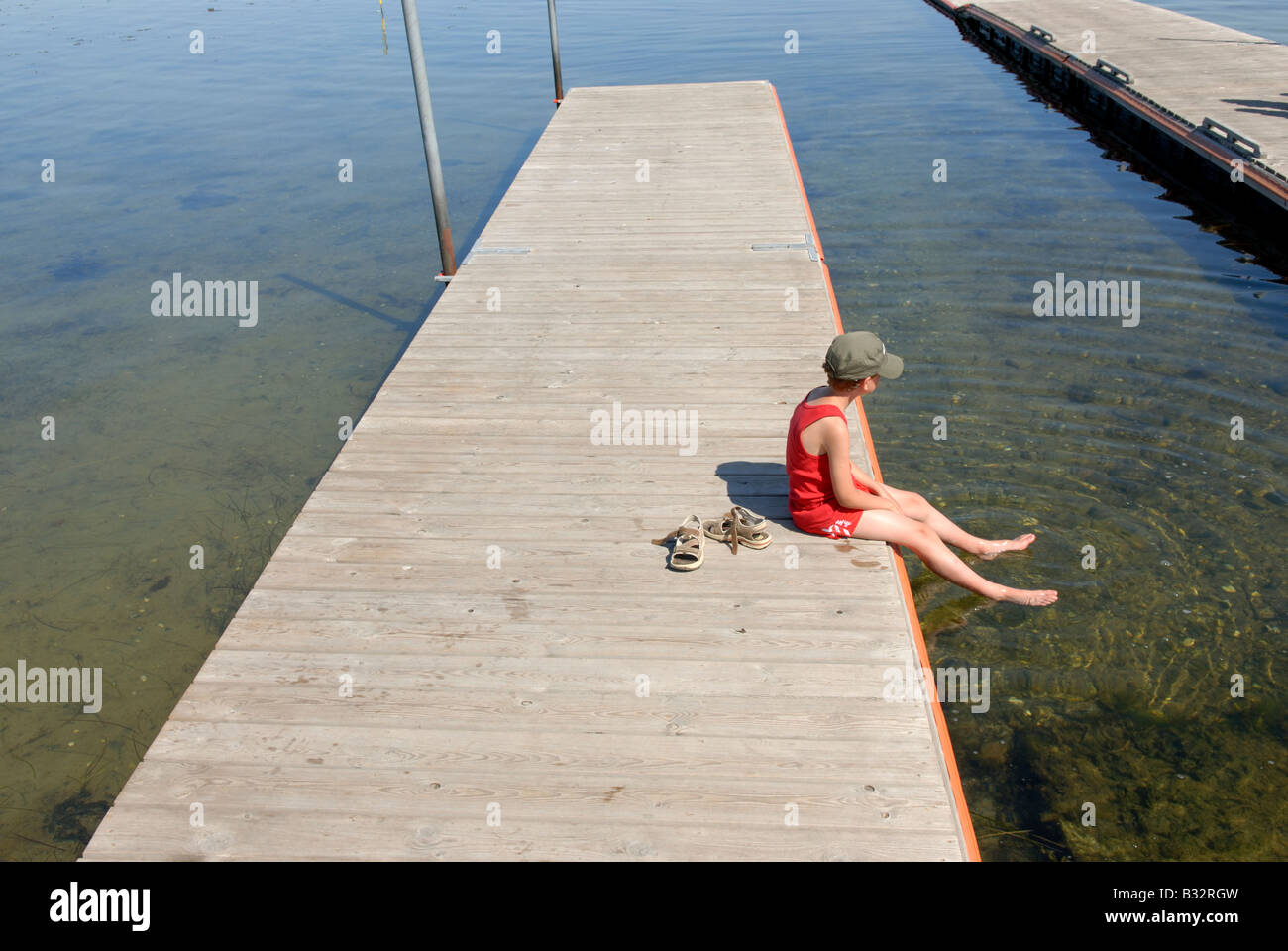 BOY ON A JETTY Stock Photo - Alamy