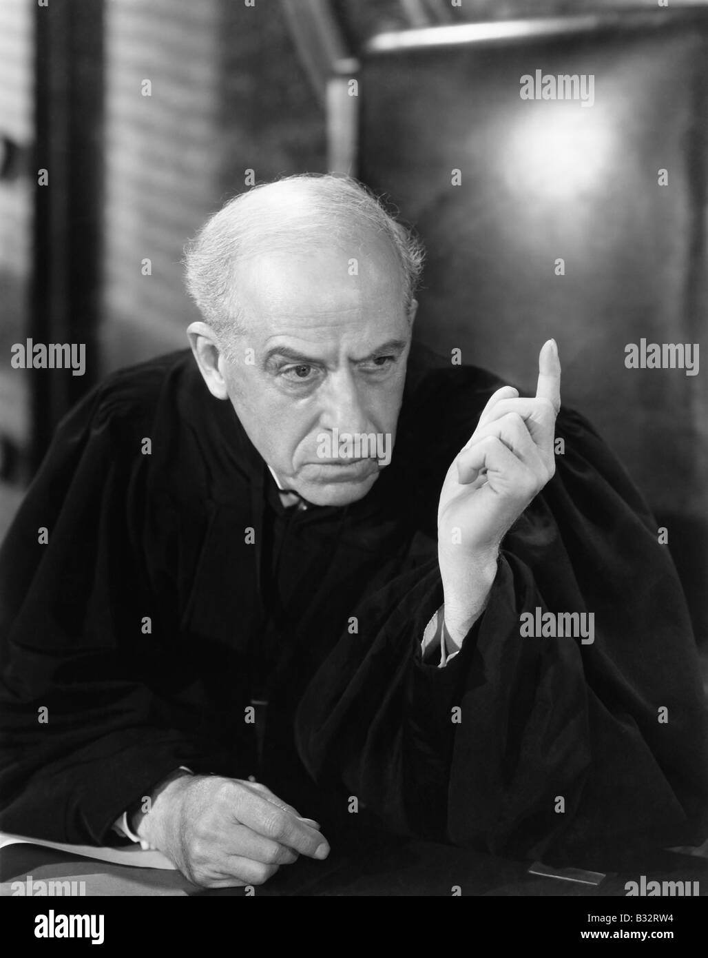 Judge in a courtroom pointing his finger up Stock Photo - Alamy