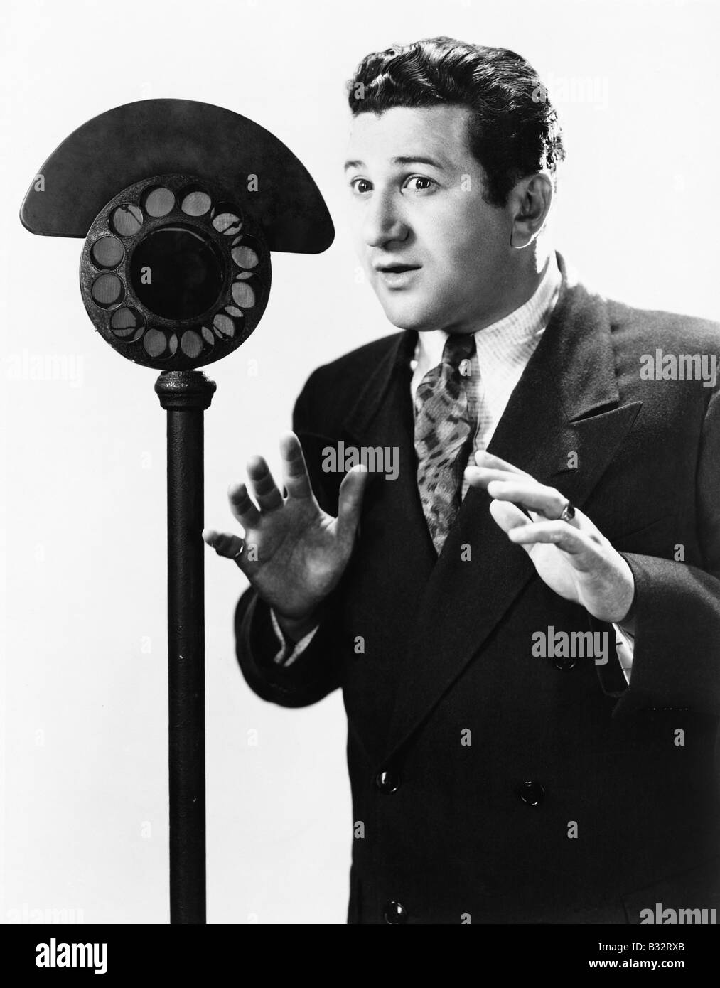 Man speaking to microphone Black and White Stock Photos & Images - Alamy