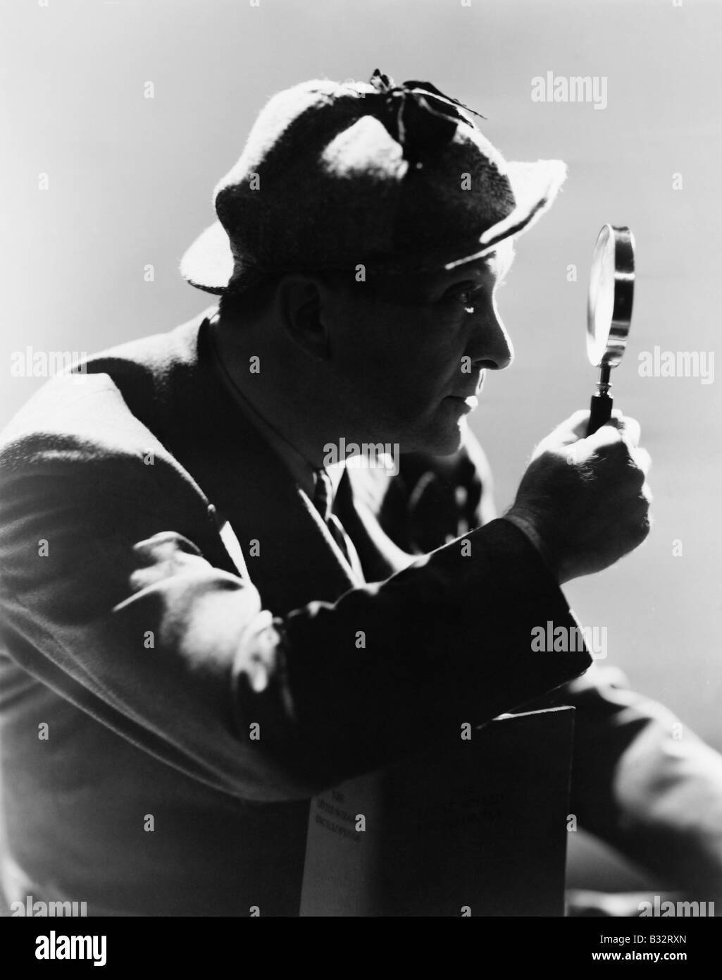 Mature man looking glass Black and White Stock Photos & Images - Alamy