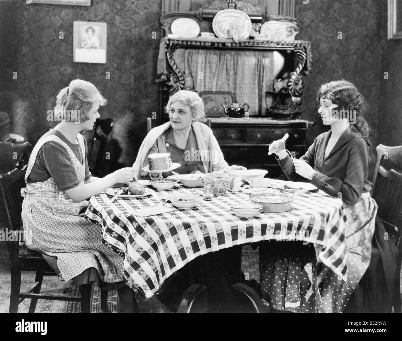 Female sitting table talking Black and White Stock Photos & Images - Alamy