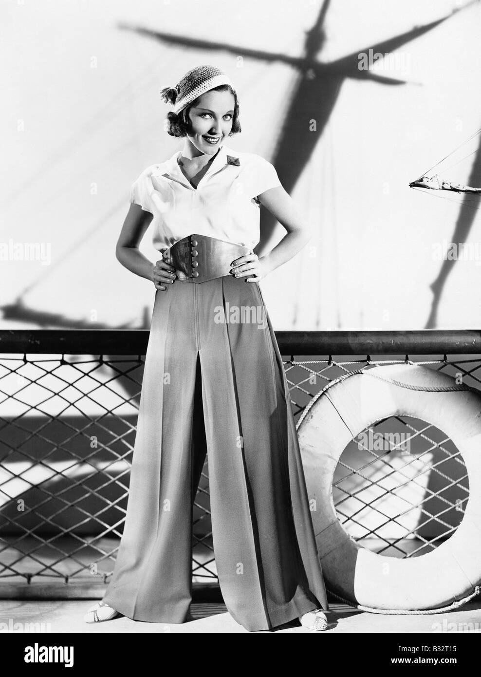 Woman with arms akimbo Black and White Stock Photos & Images - Alamy
