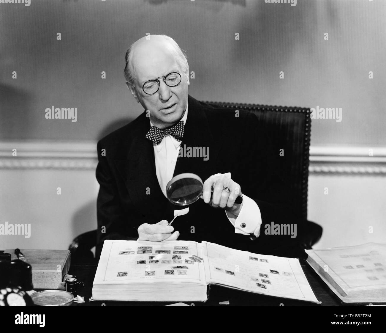 Senior man glasses holding Black and White Stock Photos & Images - Alamy