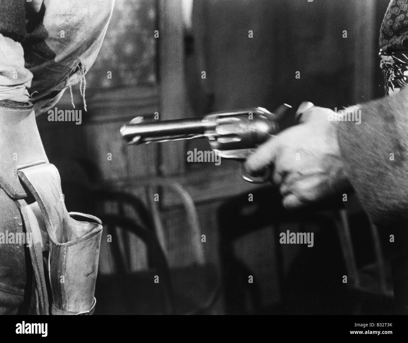 Stealing a handgun from the holster of another person Stock Photo - Alamy