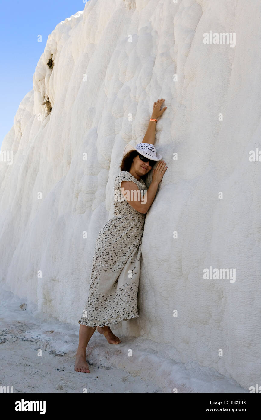 Woman posing at calcite terraces and sulphur water pools at Pamukalle ...