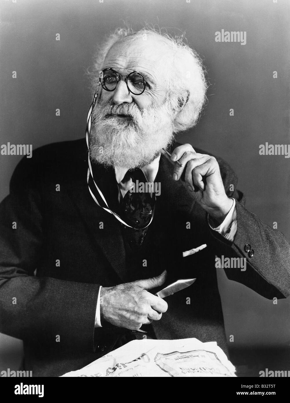 Man holding spectacles Black and White Stock Photos & Images - Alamy