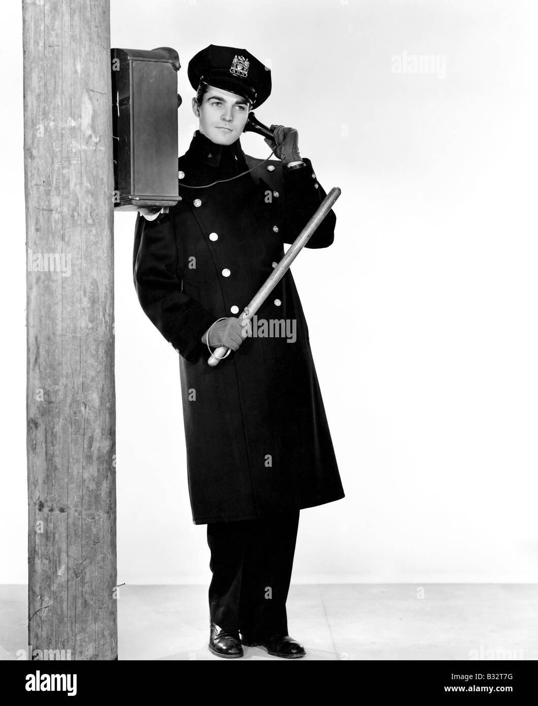 Officer holding Black and White Stock Photos & Images - Alamy