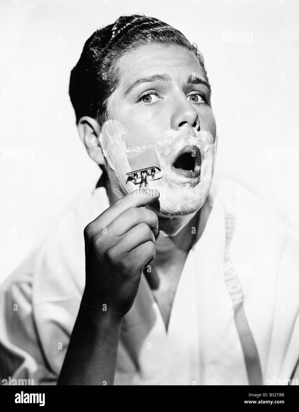 Male shaving cut Black and White Stock Photos & Images - Alamy