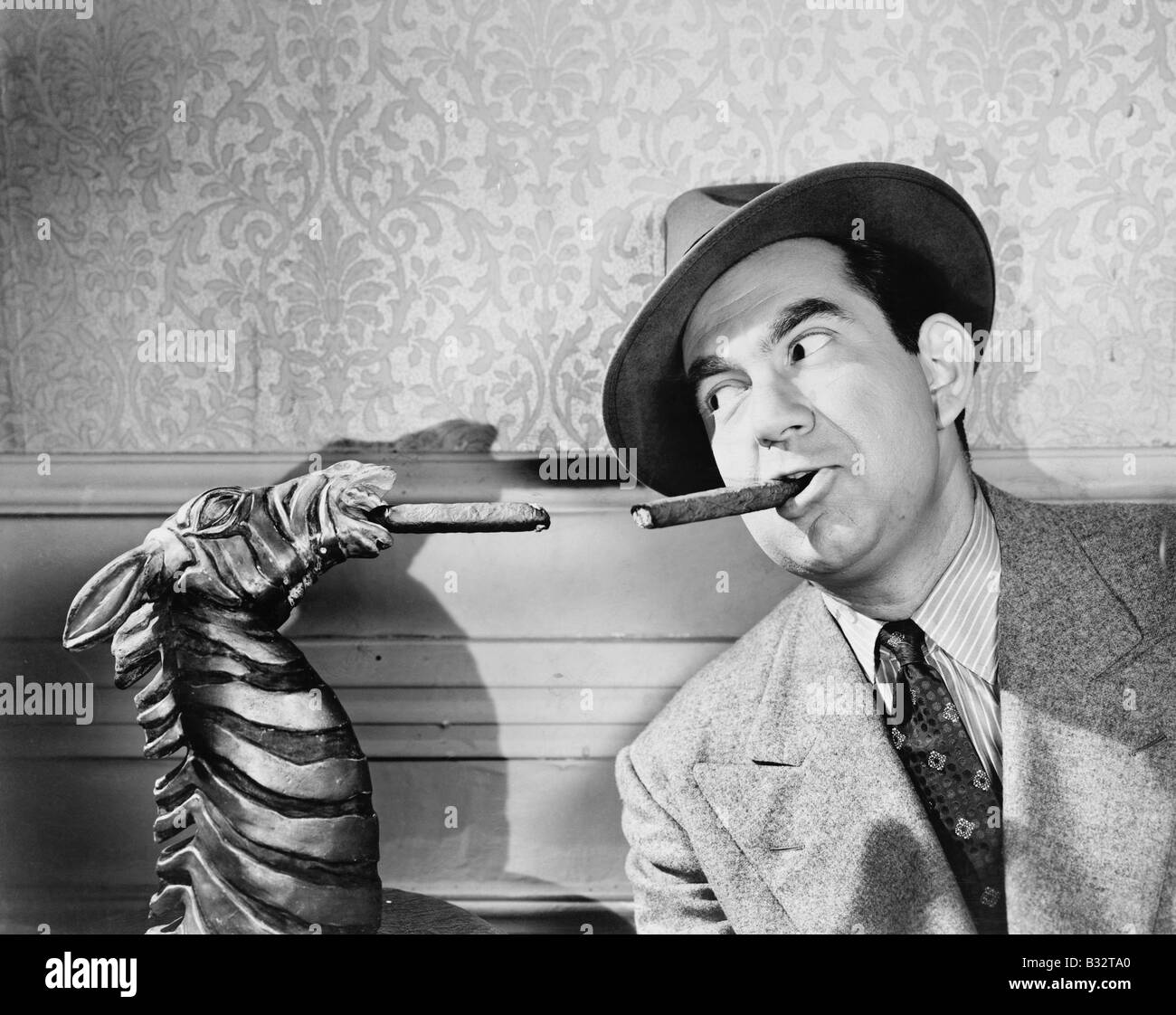 Portrait of a man smoking a cigar with a sculpture of a zebra smoking ...