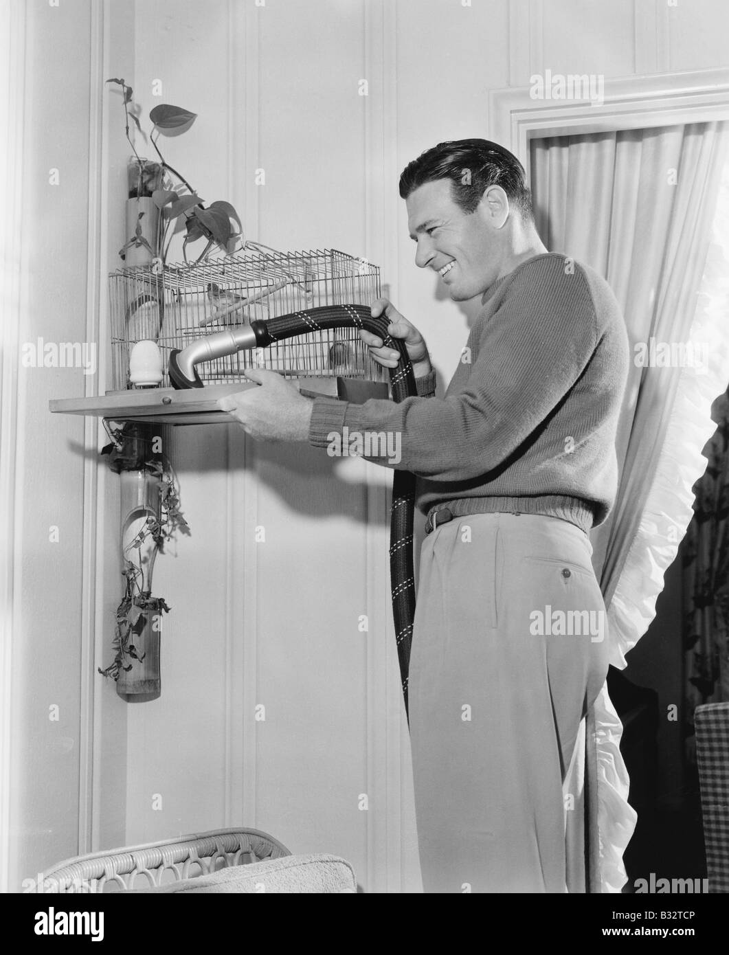 Man cleaning home Black and White Stock Photos & Images - Alamy