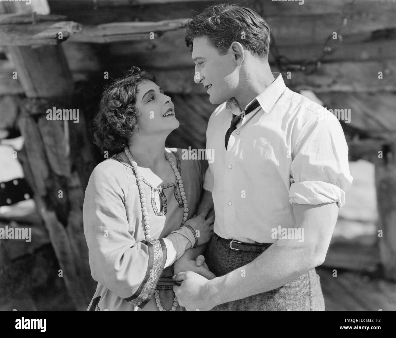 Smiling men women holding Black and White Stock Photos & Images - Alamy