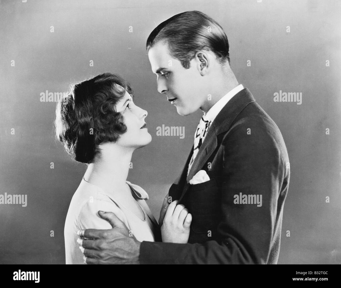 Profile of a couple romancing Stock Photo - Alamy