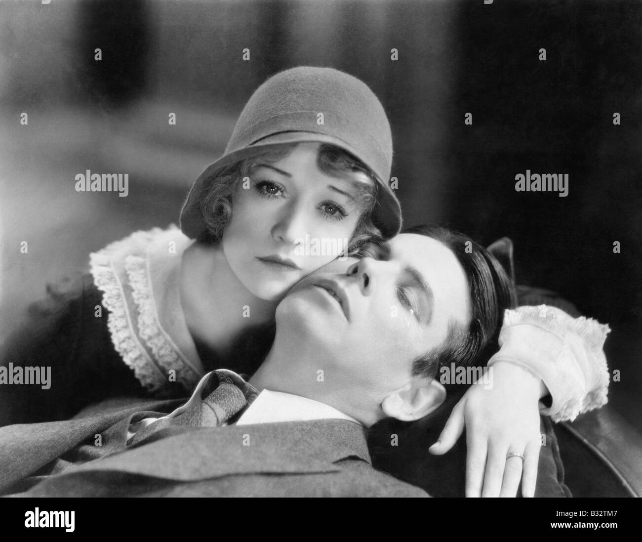 Couple leaning on each other and crying Stock Photo - Alamy