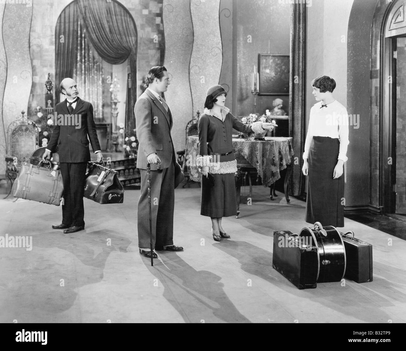 Four men standing in Black and White Stock Photos & Images - Alamy