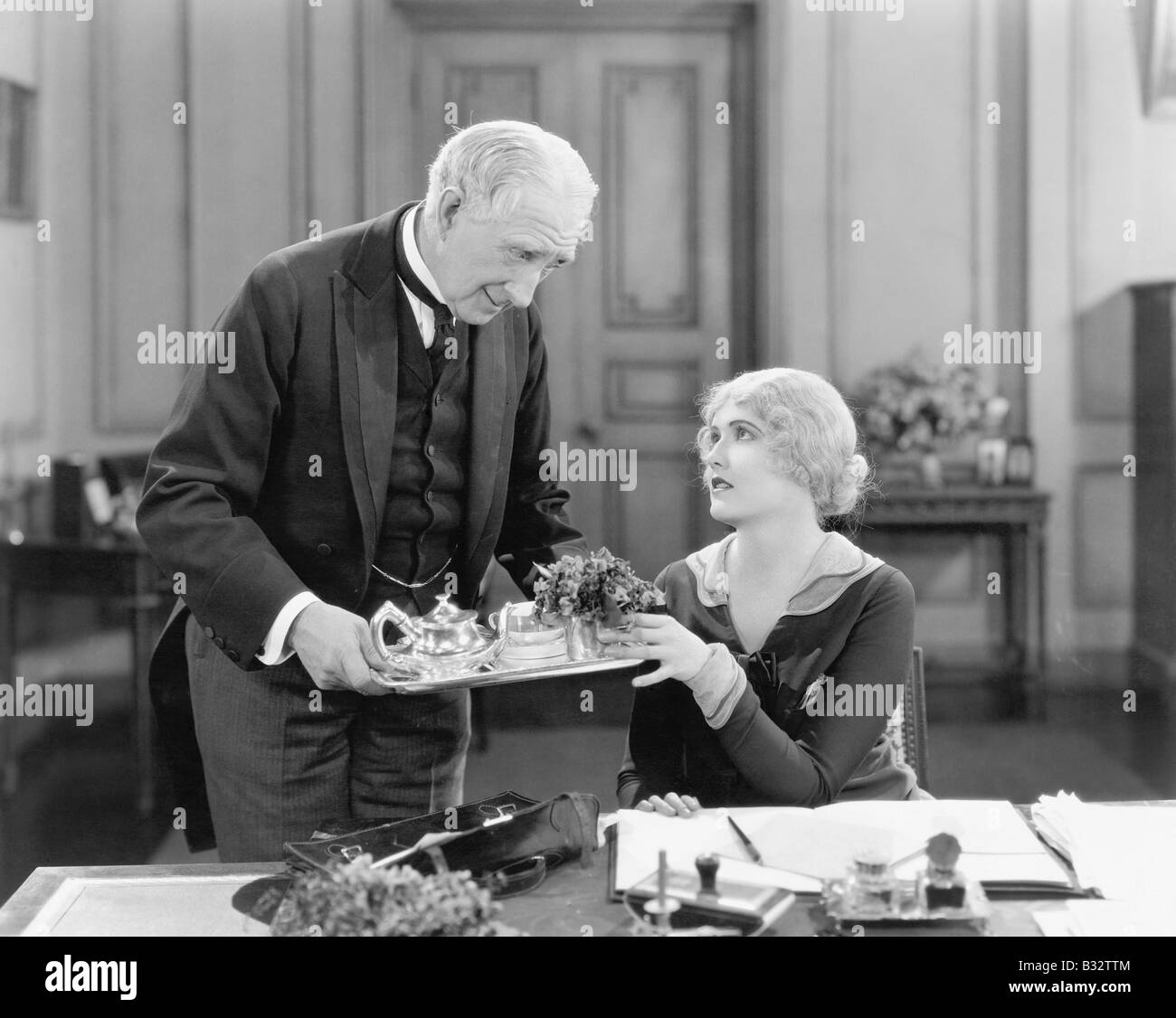 Butler serving tea hi-res stock photography and images - Alamy