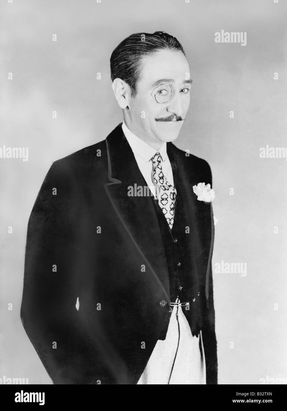 Elegantly dressed man with a monocle Stock Photo - Alamy