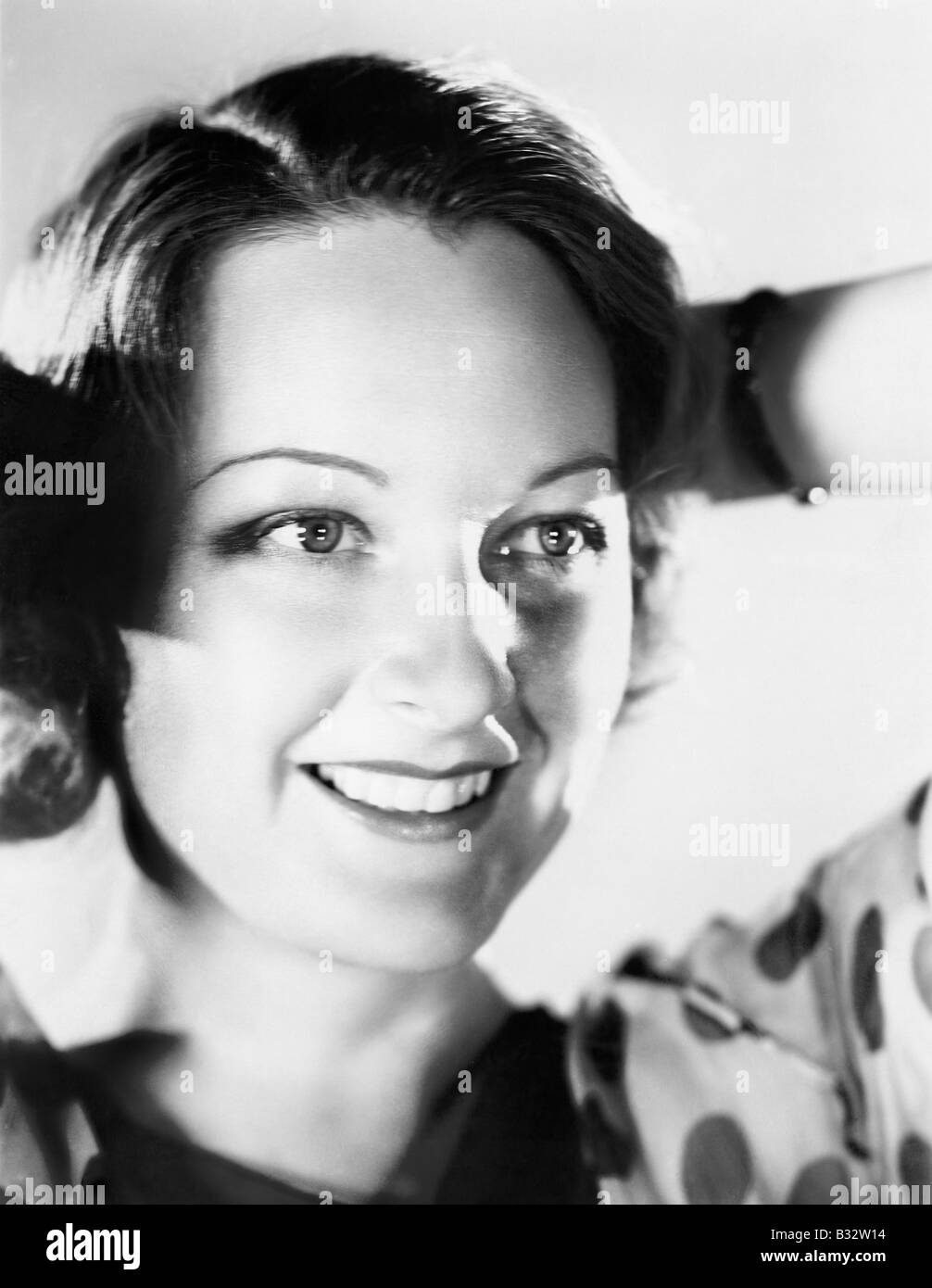 Vivacious woman smiling Stock Photo - Alamy