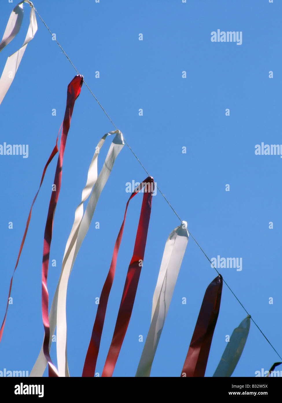 colourful carnival bunting decorations in blue sky Stock Photo - Alamy