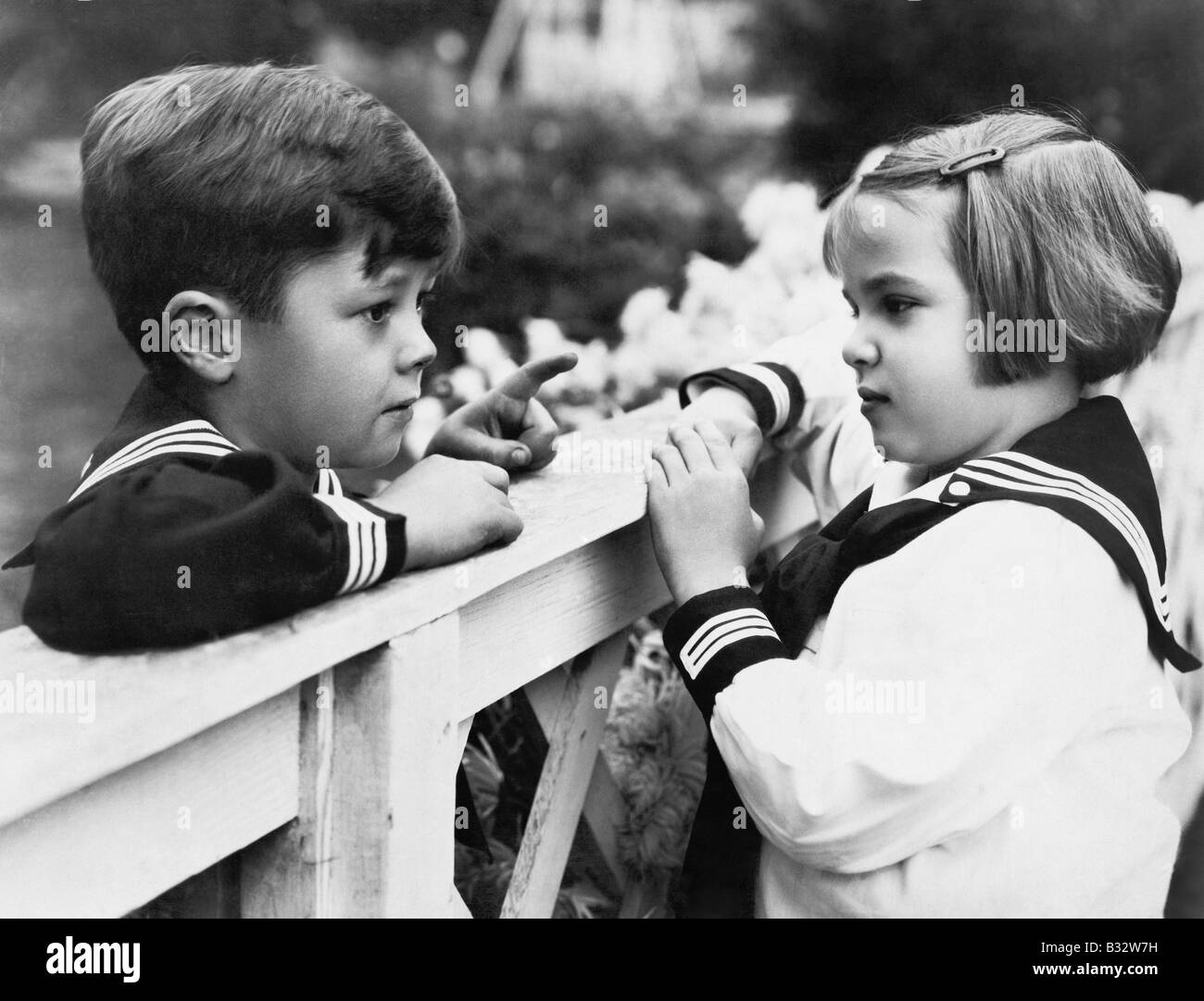 Brother and sister talking with each other Stock Photo - Alamy