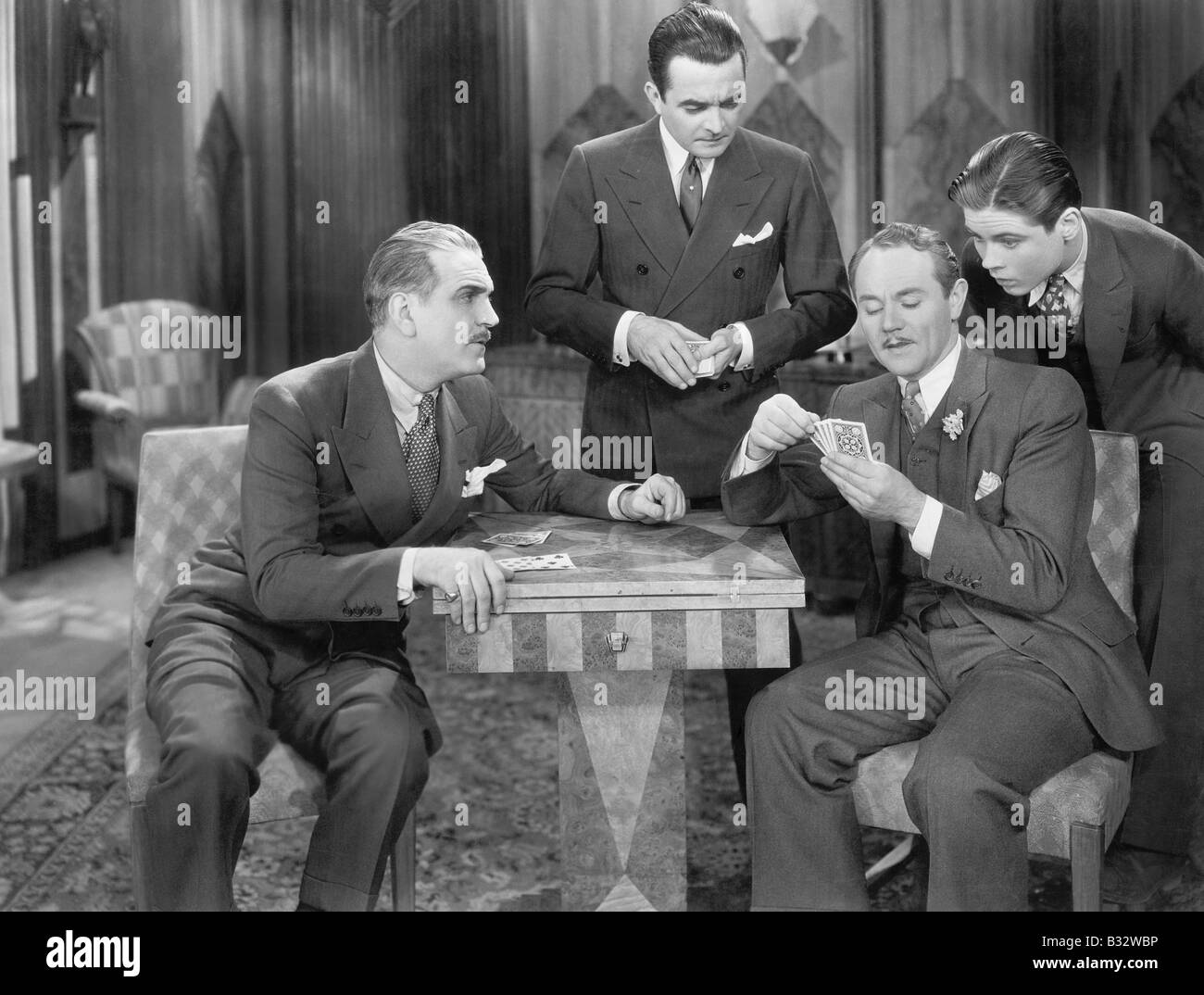 Well dressed men playing cards hi-res stock photography and images - Alamy