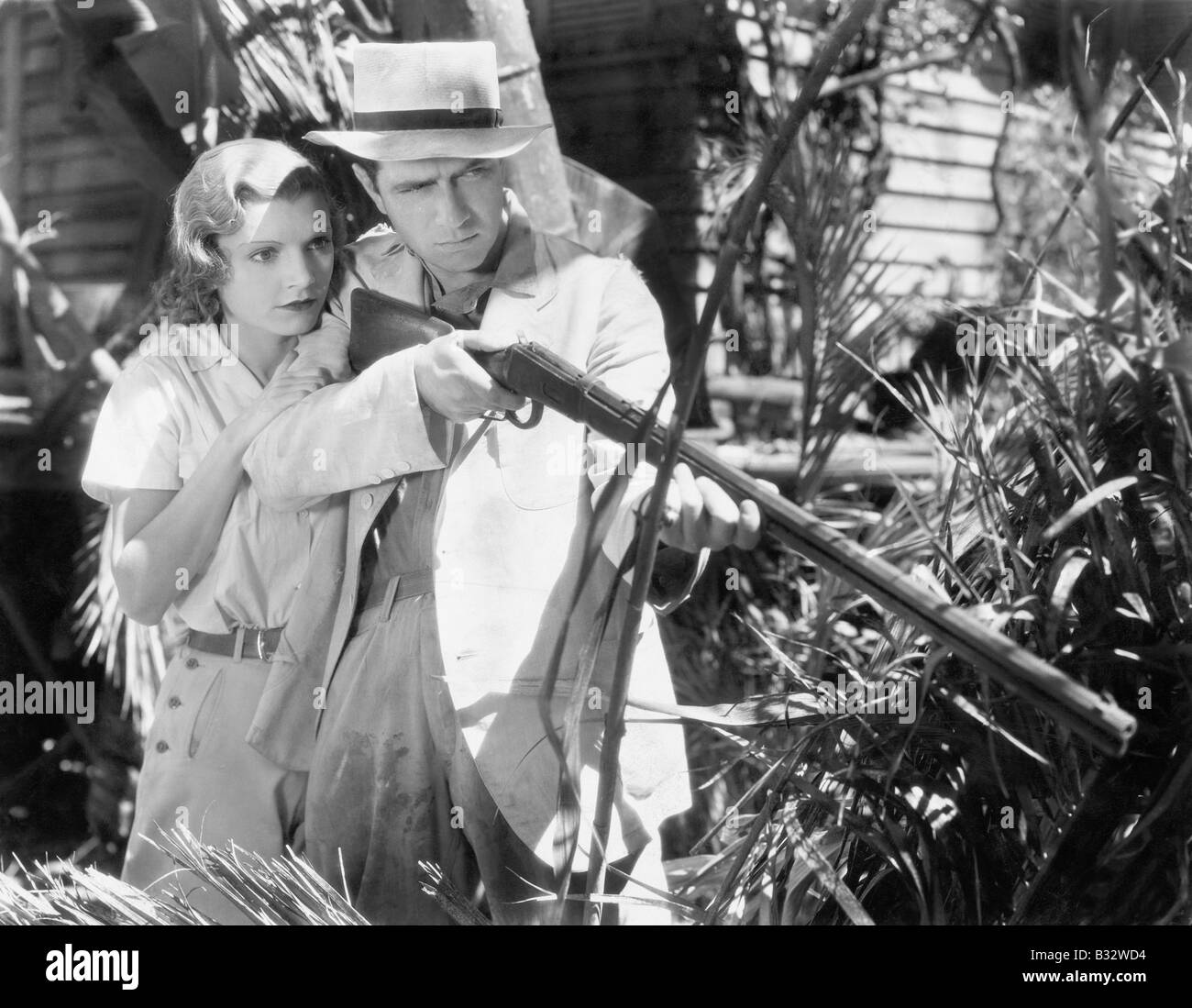 Man aiming rifle in Black and White Stock Photos & Images - Alamy