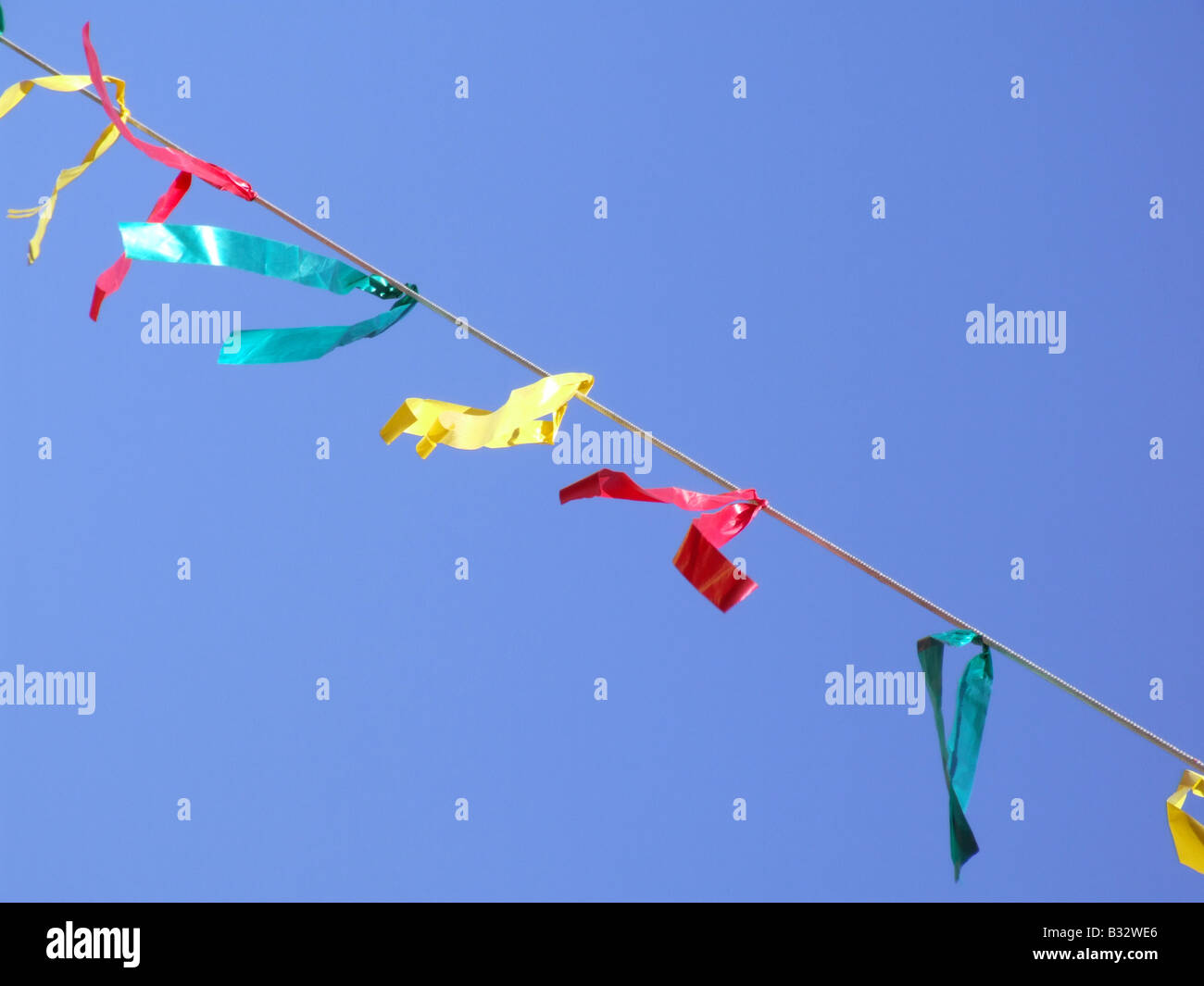 colourful carnival bunting decorations in blue sky Stock Photo - Alamy