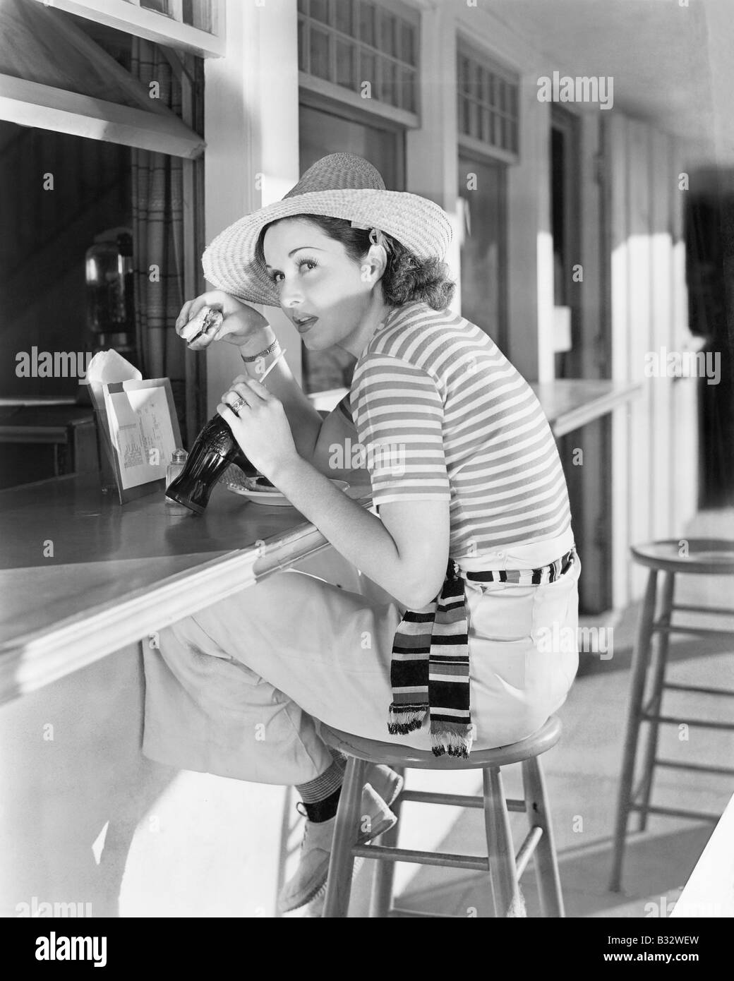 Young adult male drinking Black and White Stock Photos & Images - Alamy
