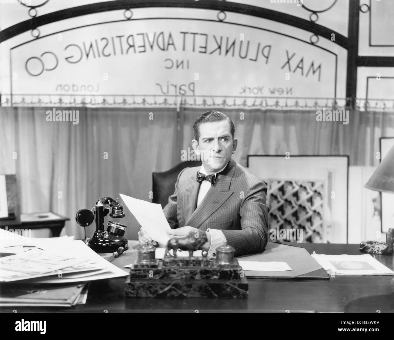 Man sits office desk Black and White Stock Photos & Images - Alamy